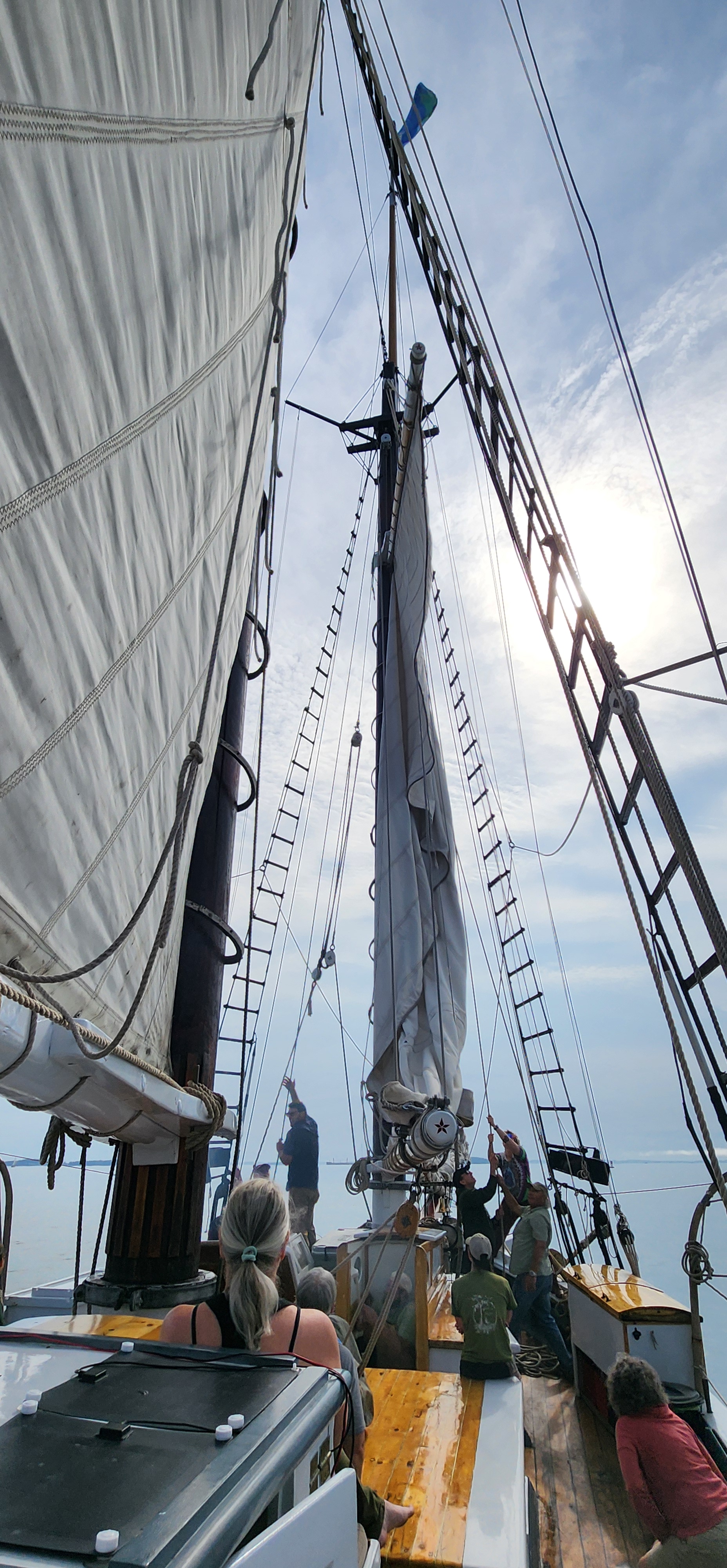 Raising the foresail in the morning – Jnana's Red Barn